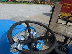 New Holland 1630 Tractor - Rogers Community Auction Inc.