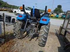 New Holland 1630 Tractor - Rogers Community Auction Inc.