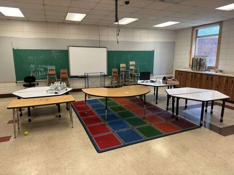 Misc classroom supplies, desk, chairs, chalk, SmartBoard without projector, Items on wall walls ...