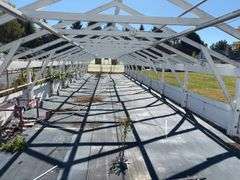 18’x135’ Wood Structure Greenhouse - RES Auction Services