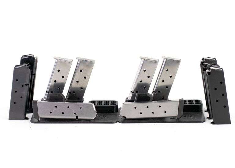 (12) 1911 Magazines & Gun Stands - RES Auction Services