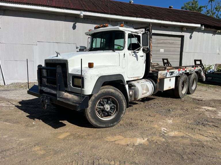 1993 Mack RD688S Flatbed Truck - RES Auction Services