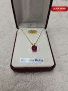 10KT yellow gold natural enhanced ruby (2.67ct) round pendant with gold plated sterling silver ...