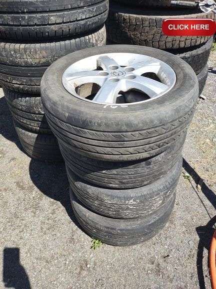 4- 205/55/16 tires on Mazda rims - Rideau Auctions