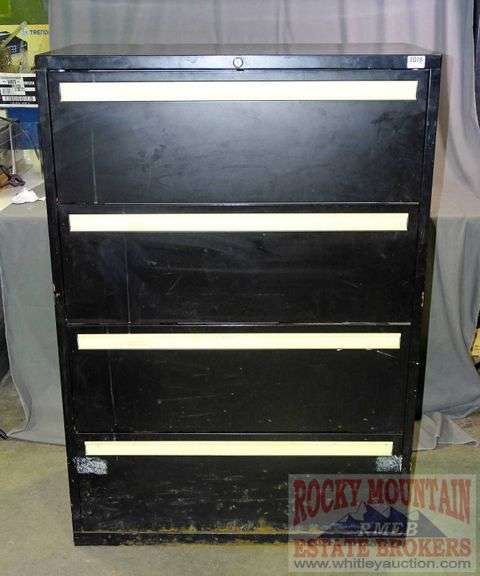 Black lateral filing cabinet with drop front doors and shelves that ...
