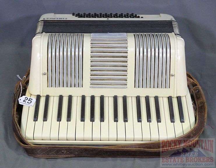 Vintage Firenze Model 1018 Accordion. - Rocky Mountain Estate Brokers Inc.