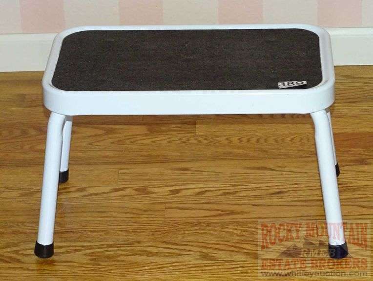Black & white metal step stool. - Rocky Mountain Estate Brokers Inc.
