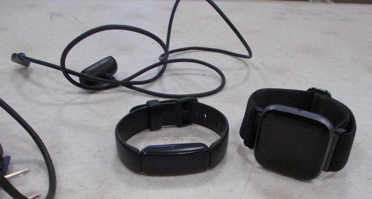 2 Fit Bit Watches W/ Chargers. - Rocky Mountain Estate Brokers Inc.