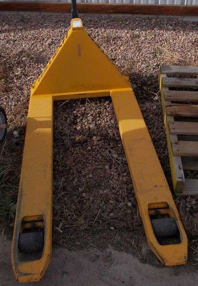 Hyster Yellow Pallet Jack. - Rocky Mountain Estate Brokers Inc.