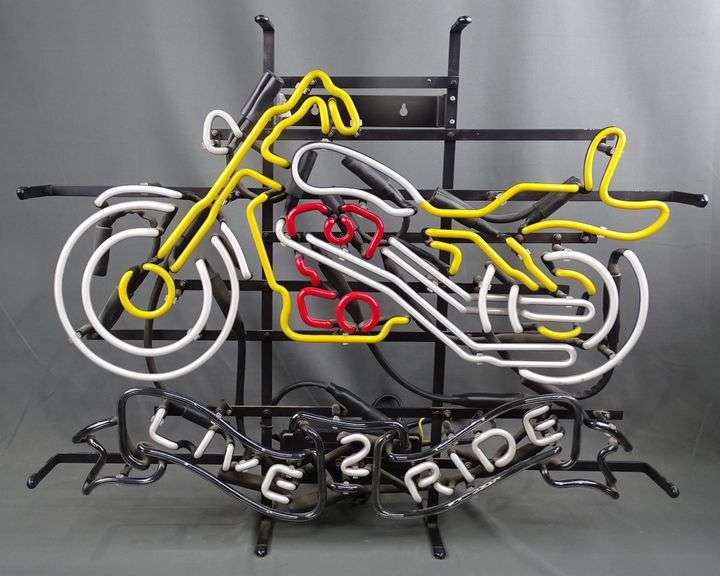"Live 2 Ride" Neon Sign, 23"x27"x3". This flashes when plugged in & may ...