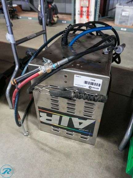 J.E. Adams Coin Operated Air Compressor - Roller Auctions