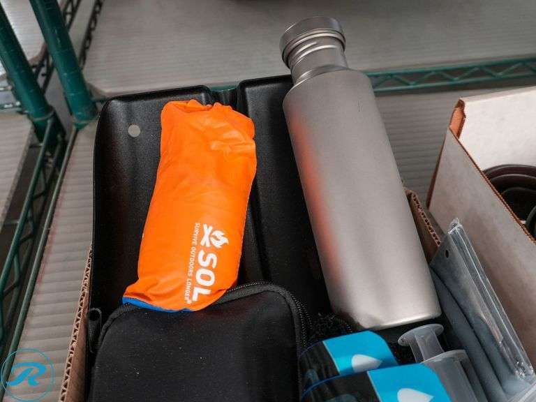 Tray of First Aid Kit, Water Filters, Bottle and Blanket - Roller Auctions