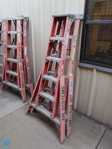 (2) 6' fiberglass 3 legged step ladder - Roller Auctions
