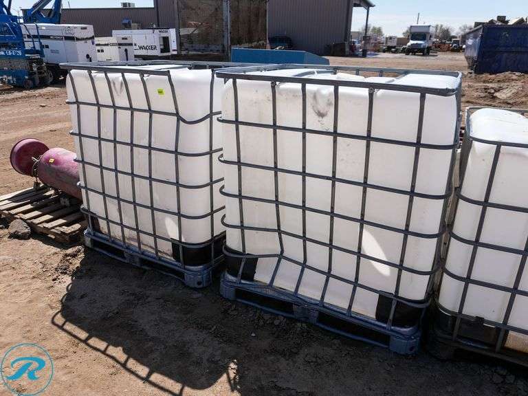 (2) Caged Poly Tanks - Roller Auctions