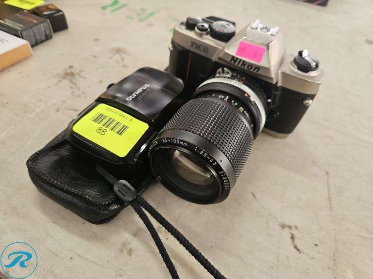 Nikon FM10, Nikkor 35-105mm Lens and Olympus Cameras - Roller Auctions