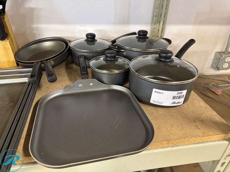 Shelf of Assorted Cookware and Utensils, Including Pots, Pans, and Baking Trays - Roller Auctions