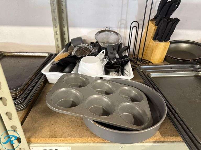Shelf of Assorted Cookware and Utensils, Including Pots, Pans, and Baking Trays - Roller Auctions