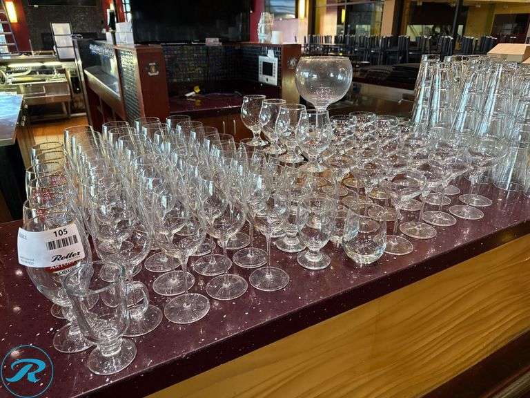 Assorted Glassware Including Stemware, Goblets, and Stella Artois Glasses - Roller Auctions