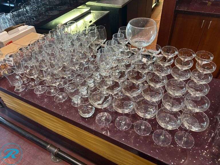 Assorted Glassware Including Stemware, Goblets, and Stella Artois Glasses - Roller Auctions