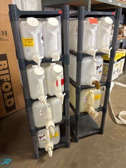 Two Racks with Plastic Containers and Dispensing Spouts - Roller Auctions