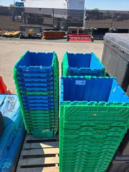 Stacked Plastic Storage Totes in Green and Blue - Roller Auctions
