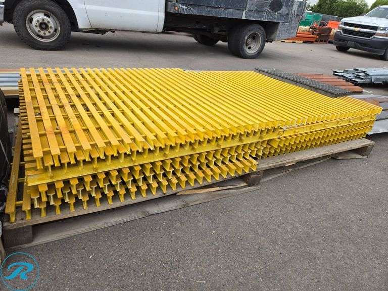 Stack of Yellow Coated Steel Grating Panels - Roller Auctions