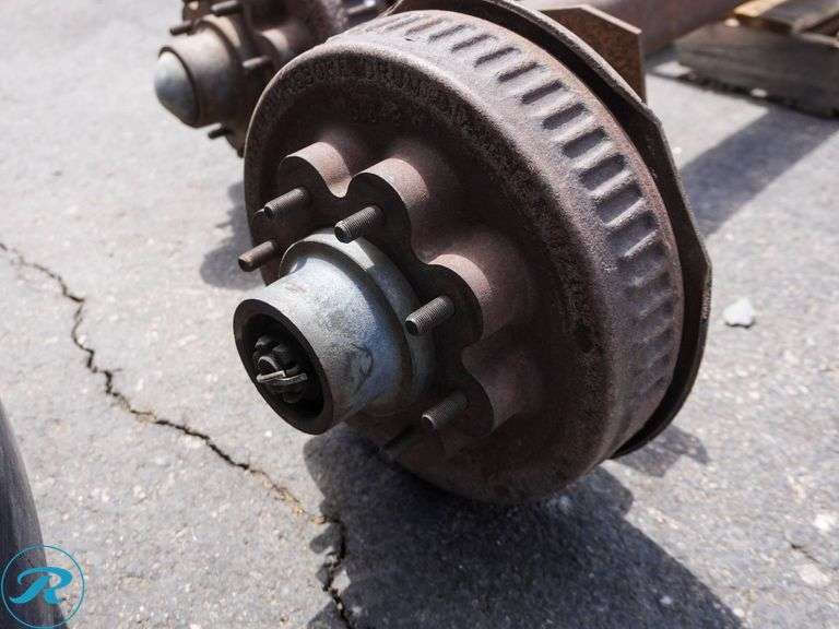 Heavy-Duty Rusted Axle Assemblies with Drum Brakes - Roller Auctions
