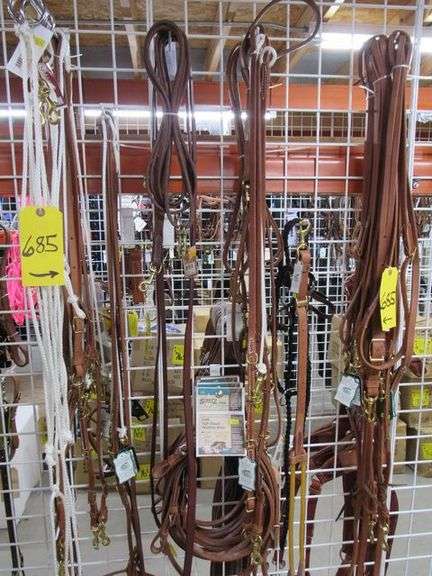 APPROX. (40) ASSORTED LEATHER HALTERS AND REINS WITH HALTERS AND ROPES ...