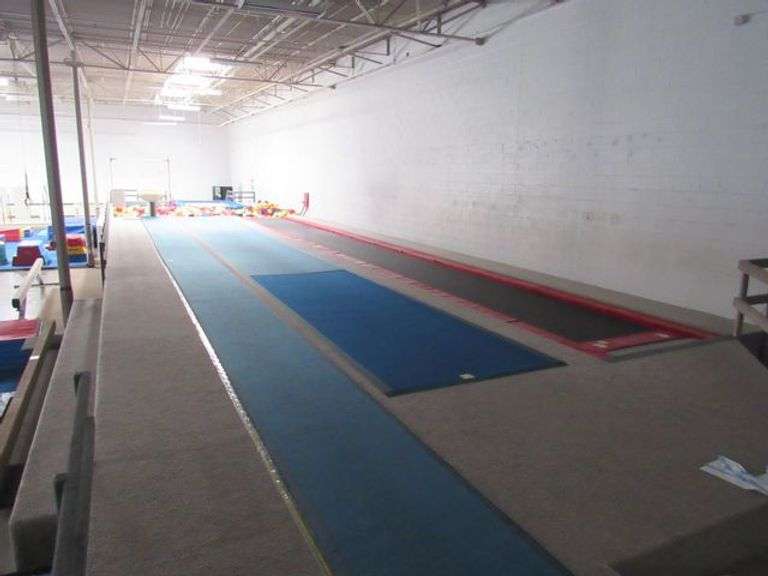 MULTI STATION GYMNASTIC TRAINING CENTER - APPROX. 24' X 100' X 4' OF ...