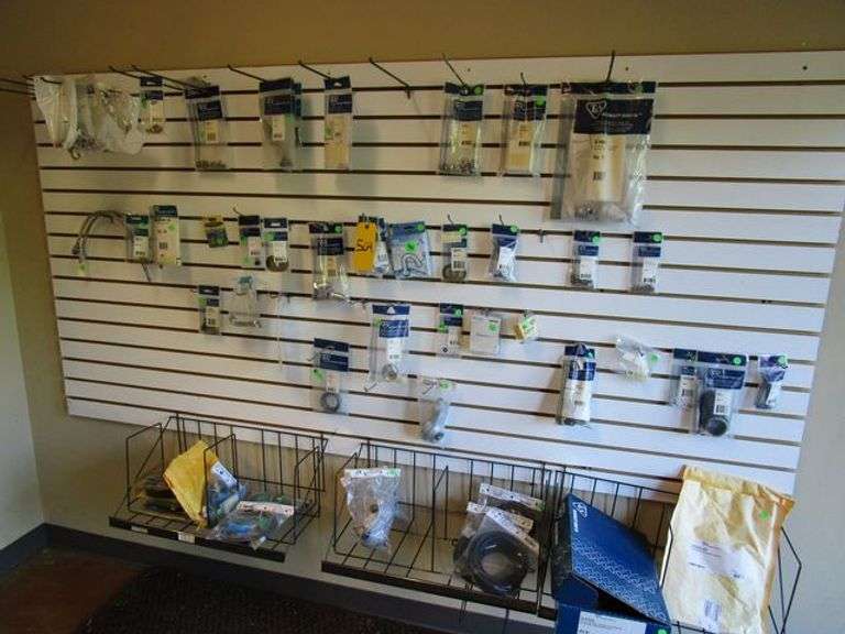 CONTENTS HANGING ON WALL, ASSORTED PLUMBING SUPPLIES AND HARDWARE AS ...