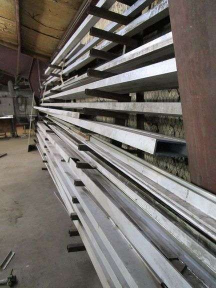 STEEL STORAGE RACK APPROX. 15' LONG X 9' TALL, W/ASSORTED ALUMINUM ...