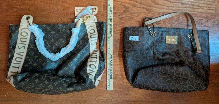 2 pc. Louis Vuitton purse and Calvin Klein, some ink stains(located in ...