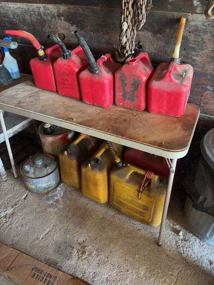 2 gallon plastic gas cans, table, other gas cans - Schmid Auction