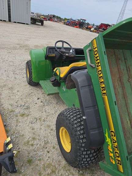 John Deere 4x2 gator, gas, manual dump bed, runs - Schmid Auction