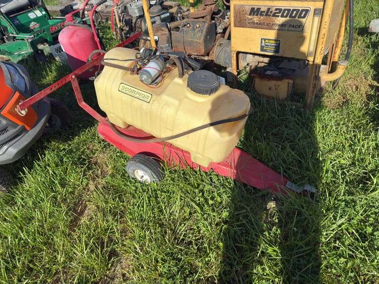 Pull behind sprayer with boom - Schmid Auction