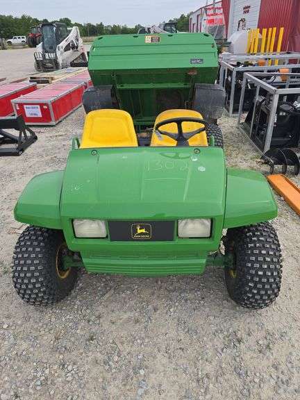 John Deere 4x2 gator, gas, manual dump bed, runs - Schmid Auction