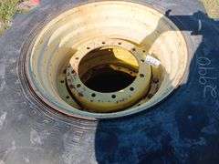 Pair of 16.9-30 JD front wheel-assist tires on rims - Schmid Auction