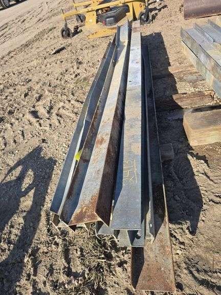Stack of 9ft long guard rail post - Schmid Auction
