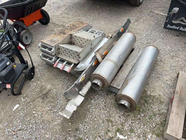 Pallet of semi mufflers, light bars, and ramps - Schmid Auction