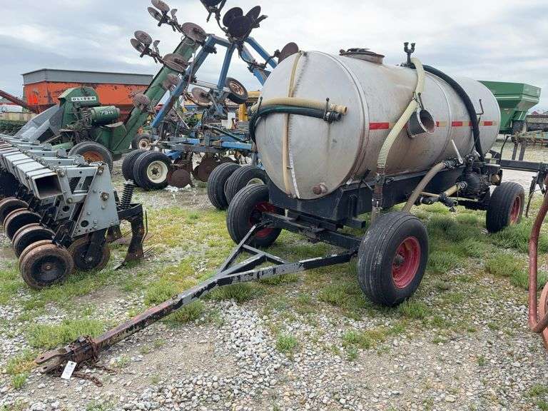 Stainless Steel 1000-gallon tank with pump and hoses - Schmid Auction