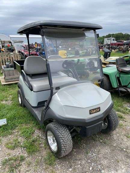 Club Car golf cart with charger (inside building) and Bluetooth speaker ...