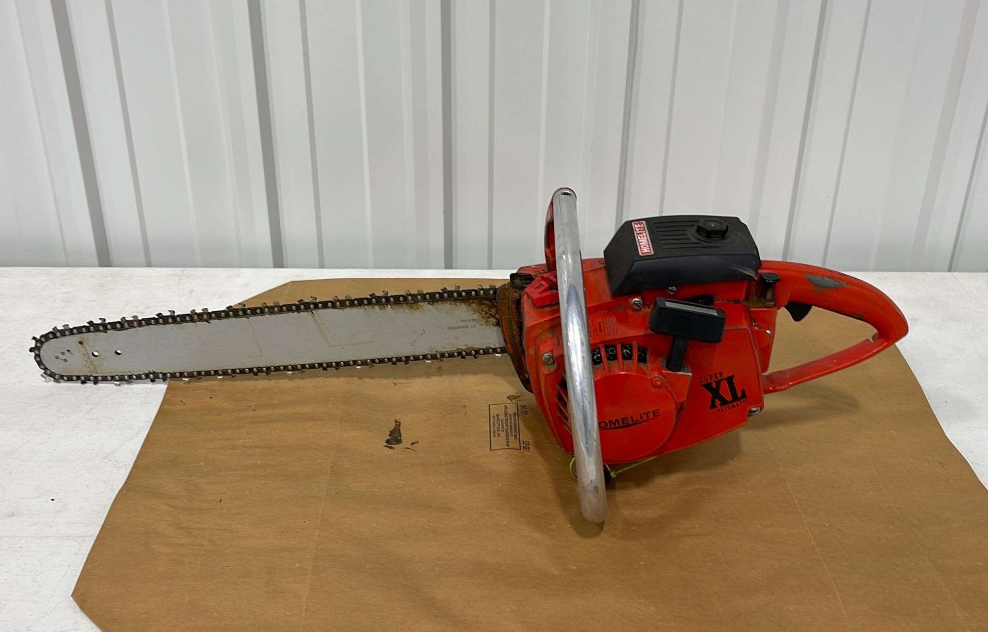 Homelite Super XL chainsaw Schneider Auctioneers LLC