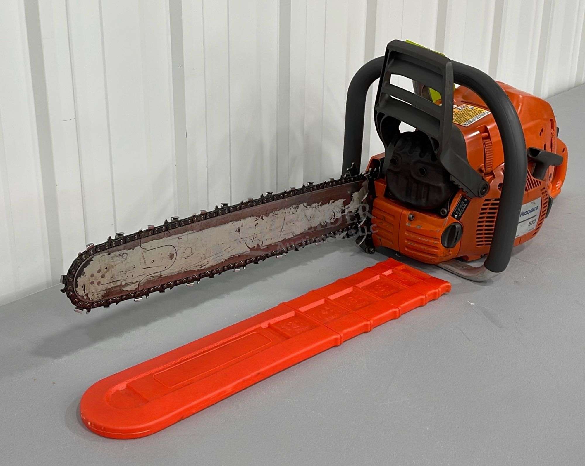 Husqvarna 570 chainsaw Schneider Auctioneers LLC