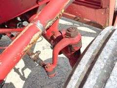 International 656 gas utility tractor w/ loader - Schneider Auctioneers LLC