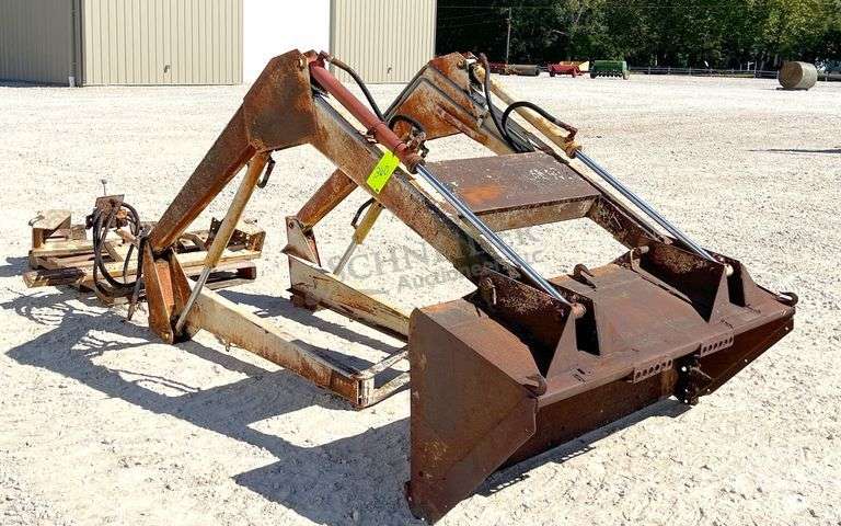 Loader w/ brackets off of a Case tractor - Schneider Auctioneers LLC