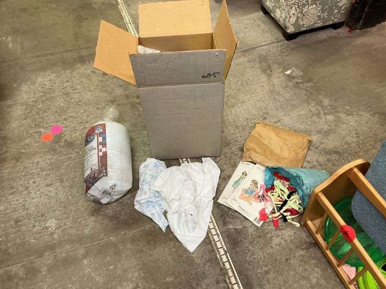 box with scraps of material, two patterns ,lace, a roll of batting ...