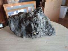 basaltic spatter rock and a vintage oil lamp holder - SCHULTIS & SON, INC.