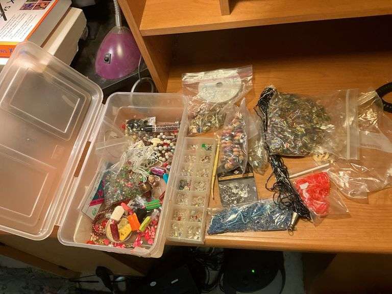 Container of different size colored beads, - SCHULTIS & SON, INC.