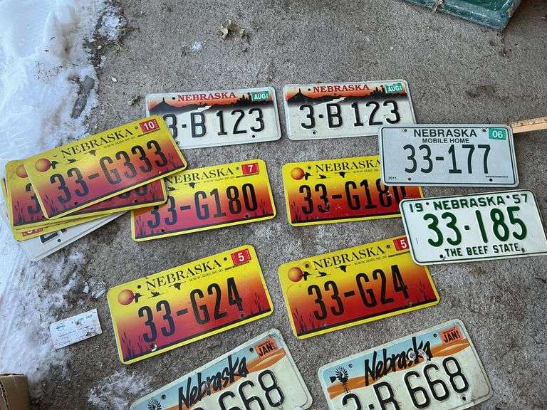 assortment of old license plates - SCHULTIS & SON, INC.