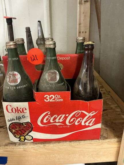 32 ounce size cardboard Coca-Cola container with 7-Up bottles and one ...